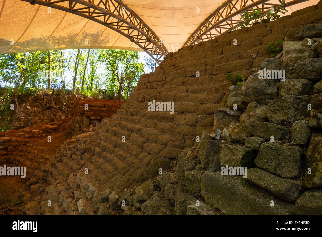 Troy ancient city ruins. Reconstructed mudbrick wall of Troy. Visit ...