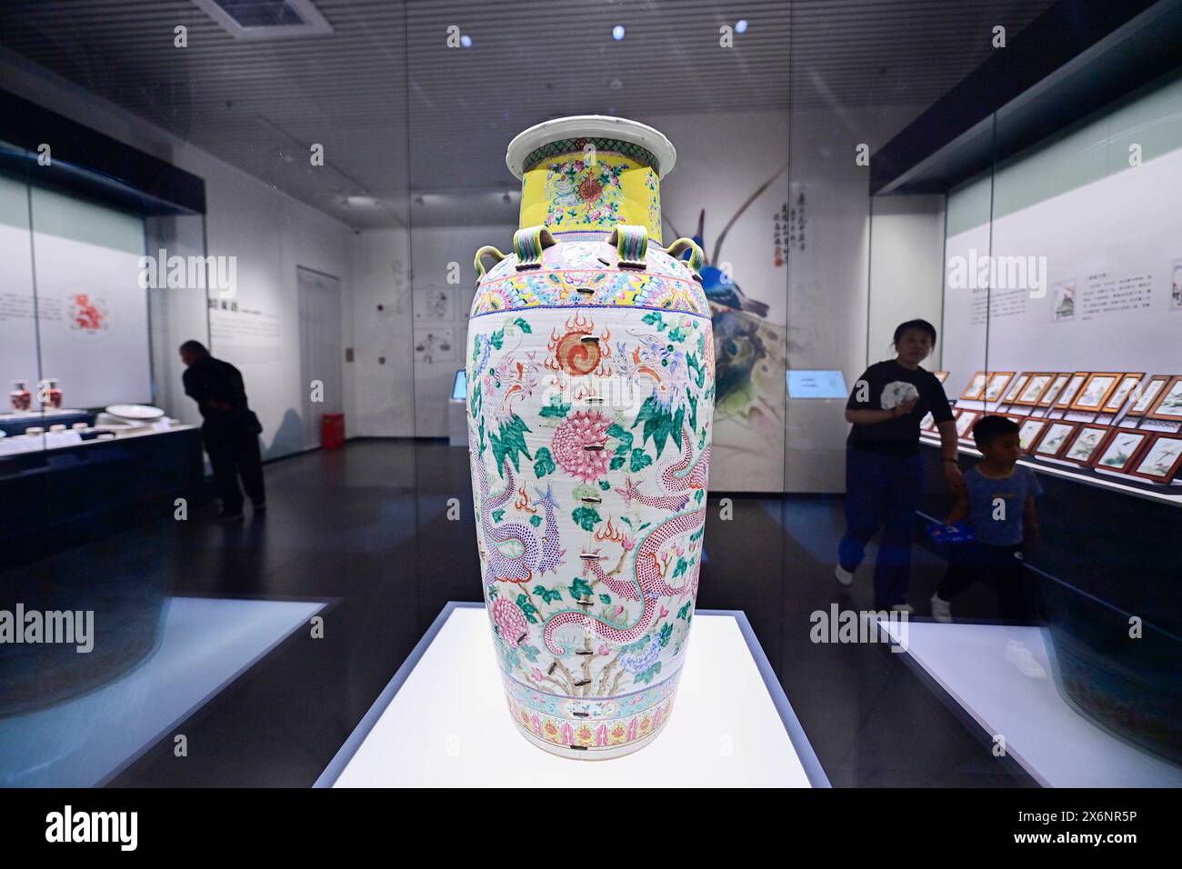 Visitors look at a cultural relics exhibition at Qingzhou Museum in ...