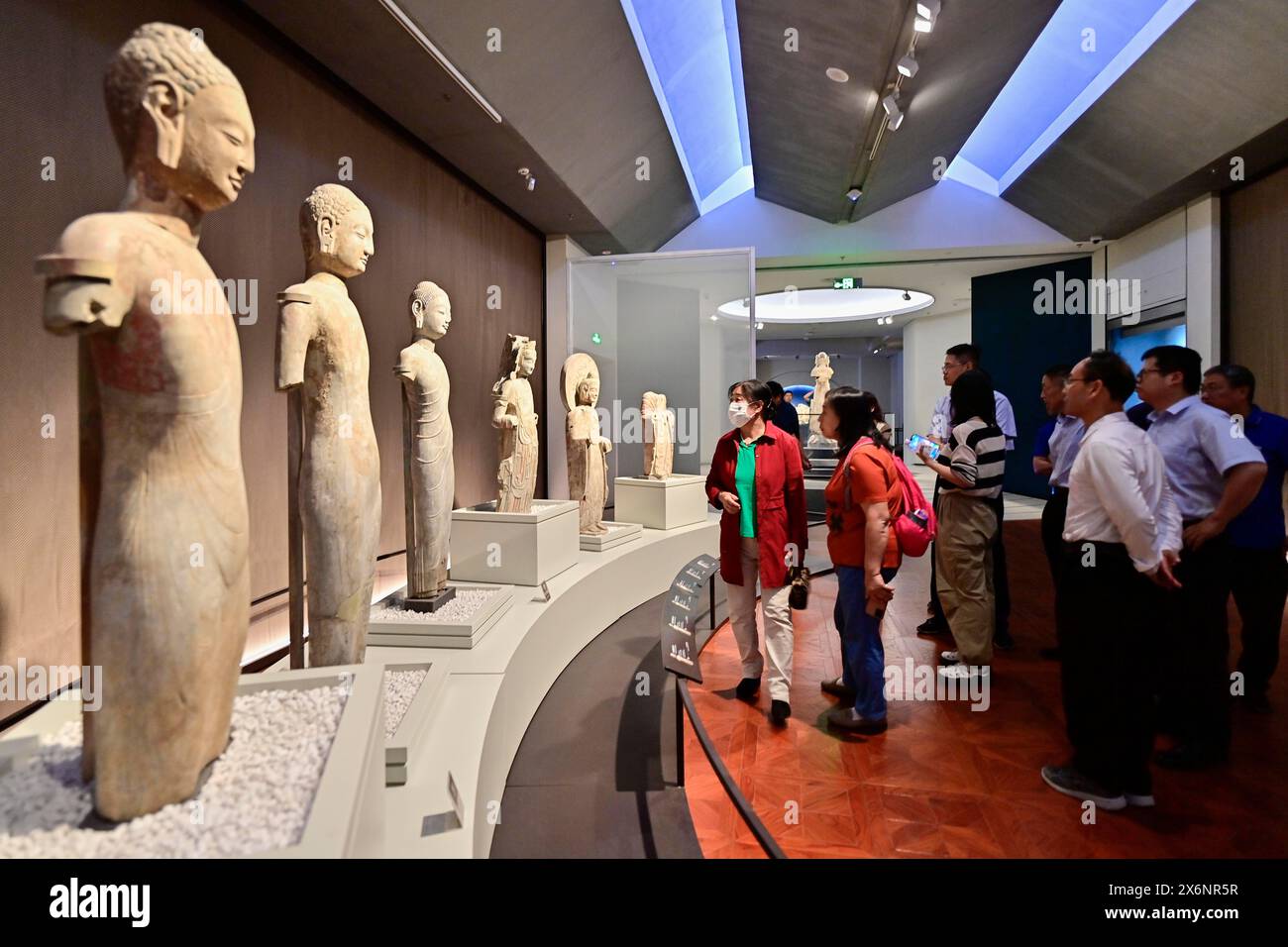 Visitors look at a cultural relics exhibition at Qingzhou Museum in ...