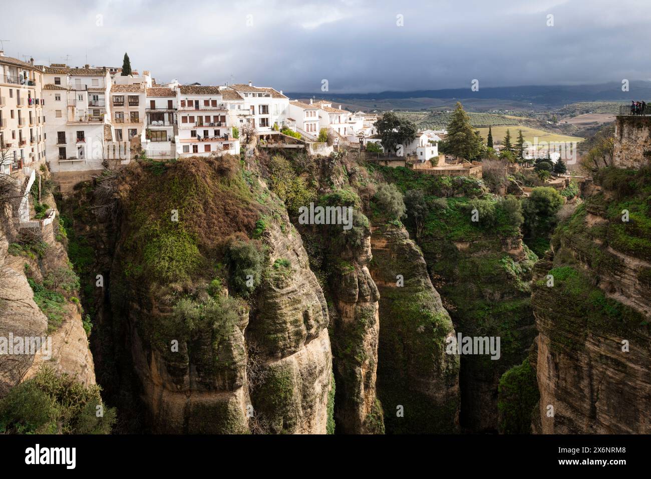 White-washed homes on top of a steep cliff overlooking the Guadalevín ...