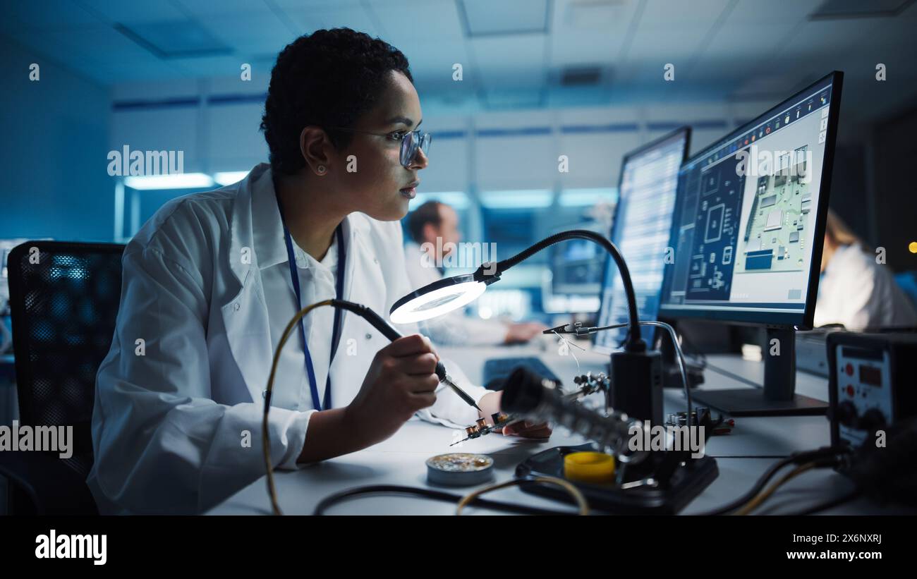 Modern Electronics Research, Development Facility: Black Female Engineer Does Computer ...
