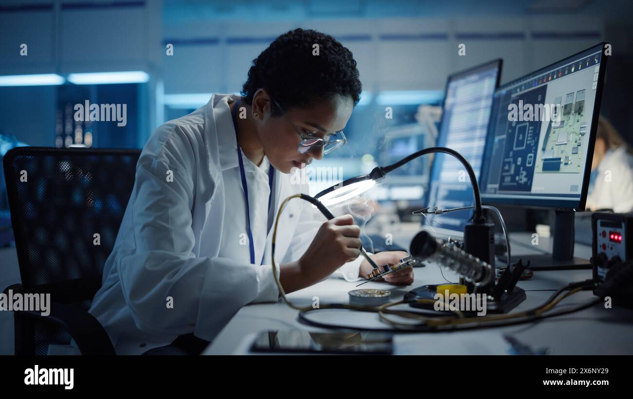 Modern Electronics Research, Development Facility: Black Female Engineer Does Computer ...