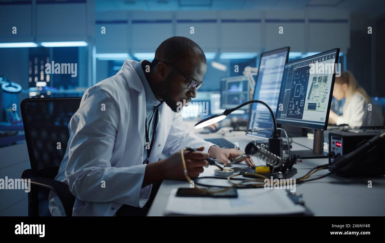 African american engineer soldering pcb hi-res stock photography and ...