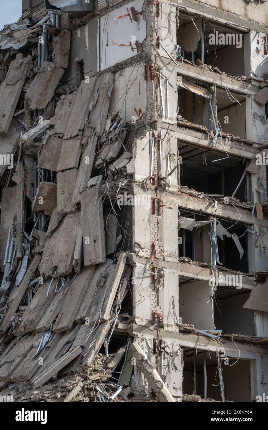 Close-up of a ruined multi-story building with exposed structural ...