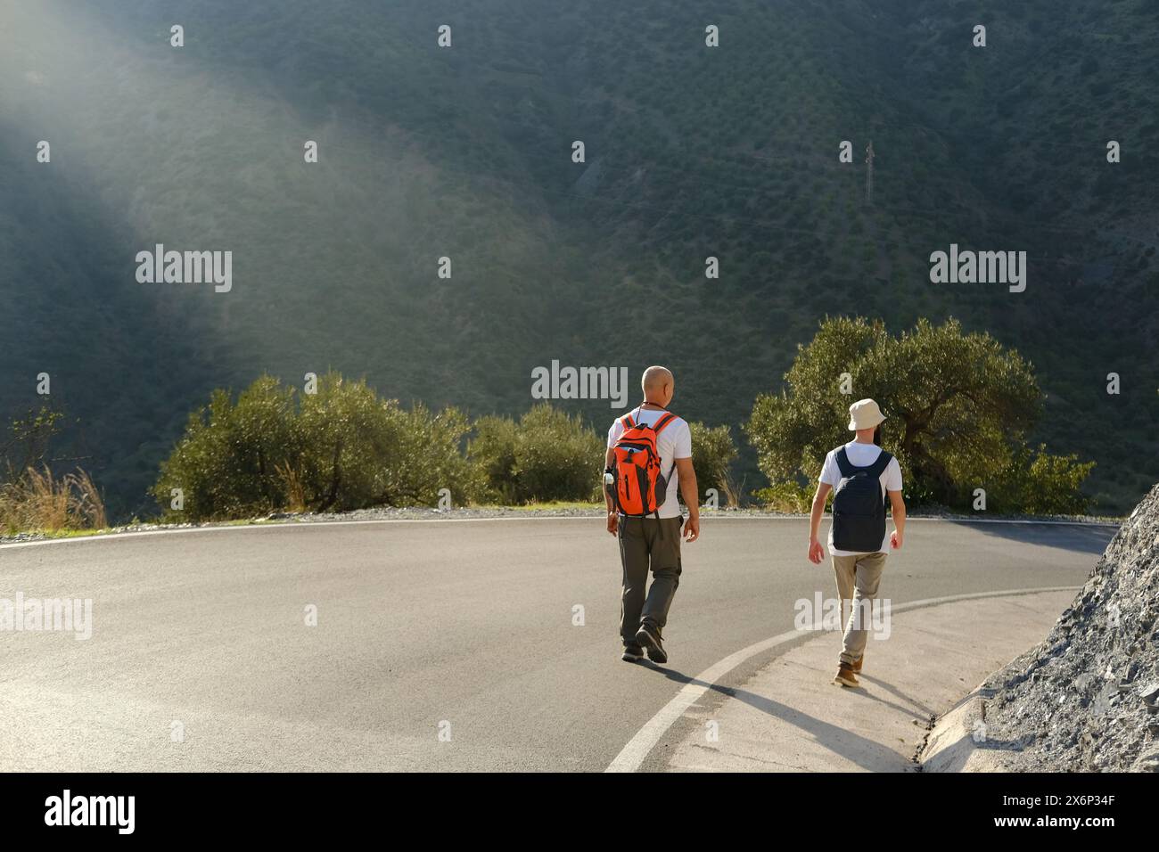 two men with backpacks, mature man 60 years and man 30 years old ...
