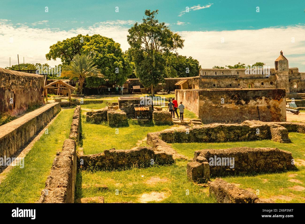A group of friends exploring the ruins of Fort Jesus in Mombasa, Kenya ...