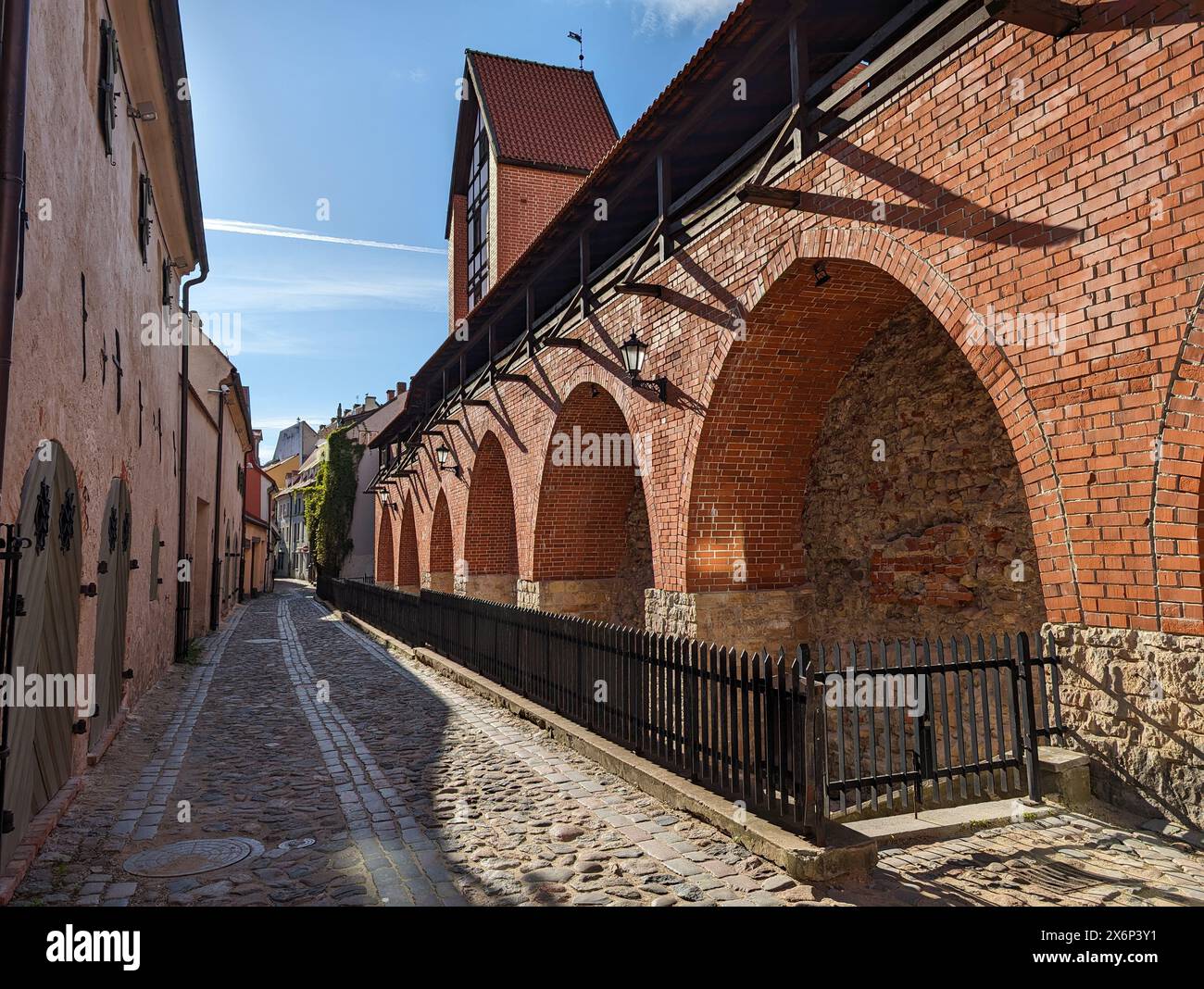 Old medieval narrow street in Riga, Latvia. Medieval Jacobs barracks ...
