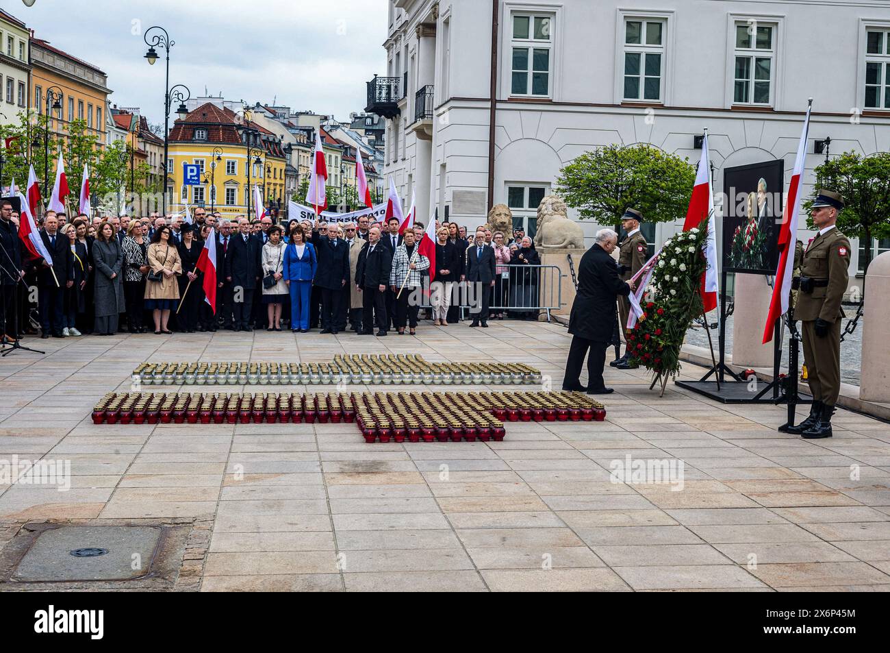 April 10, 2024, Warsaw, Mazovia, Poland: Jaros?aw Kaczy?ski corrects the ribbons attached to the ...