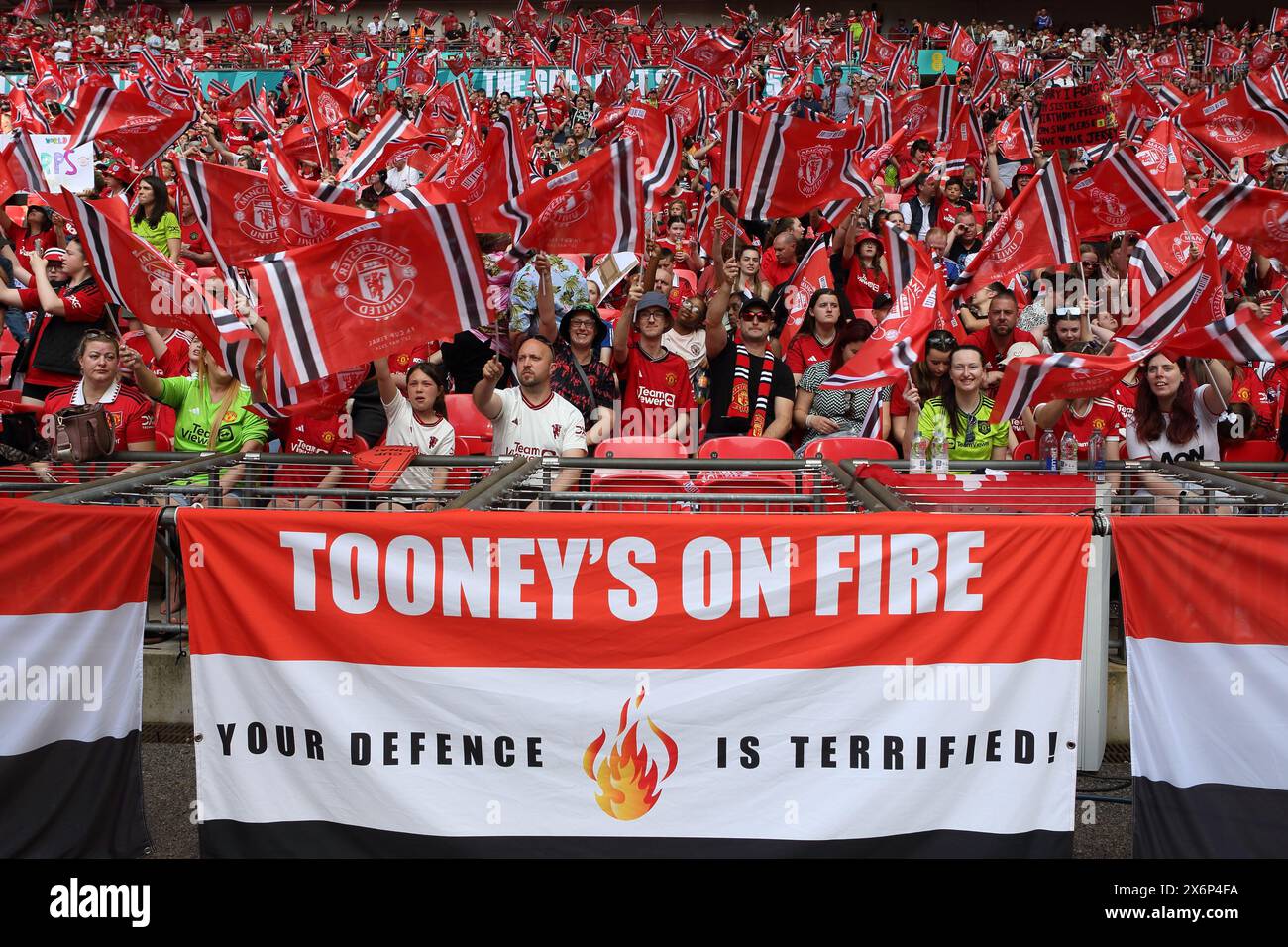 Manchester United women fans with red flags Ella Toone flag Tooneys on ...