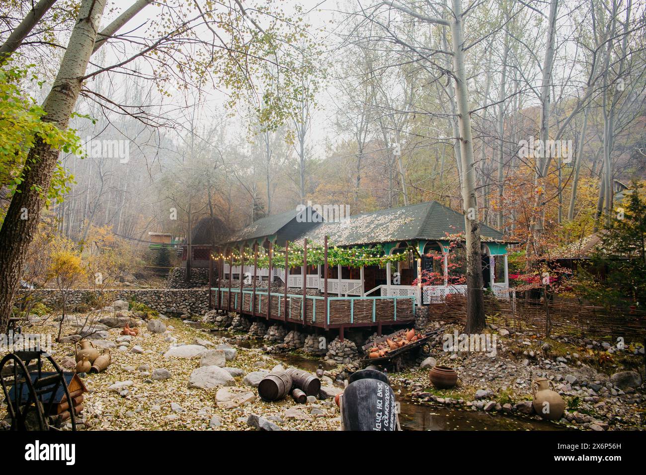 Rustic cabin nestled amidst colorful autumn forest and river Stock ...