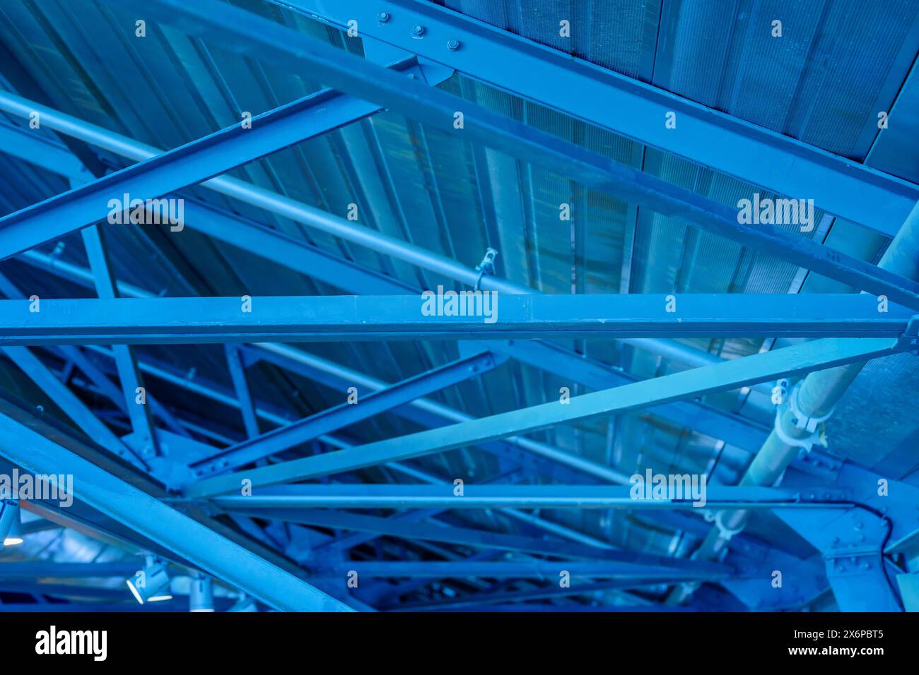 View of warehouse building with various colorful rafters (roof beams ...