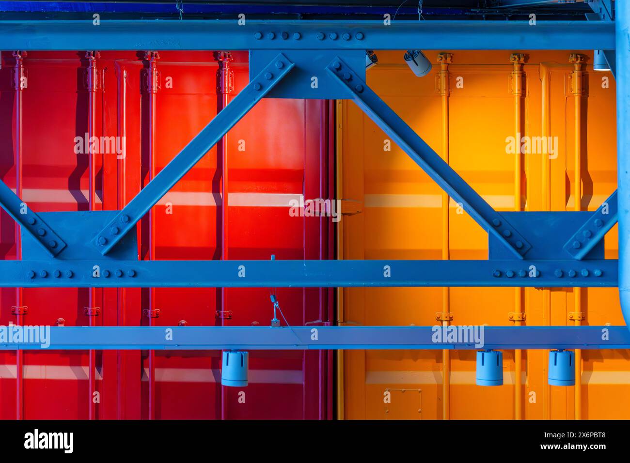 View of warehouse building with various colorful rafters (roof beams ...