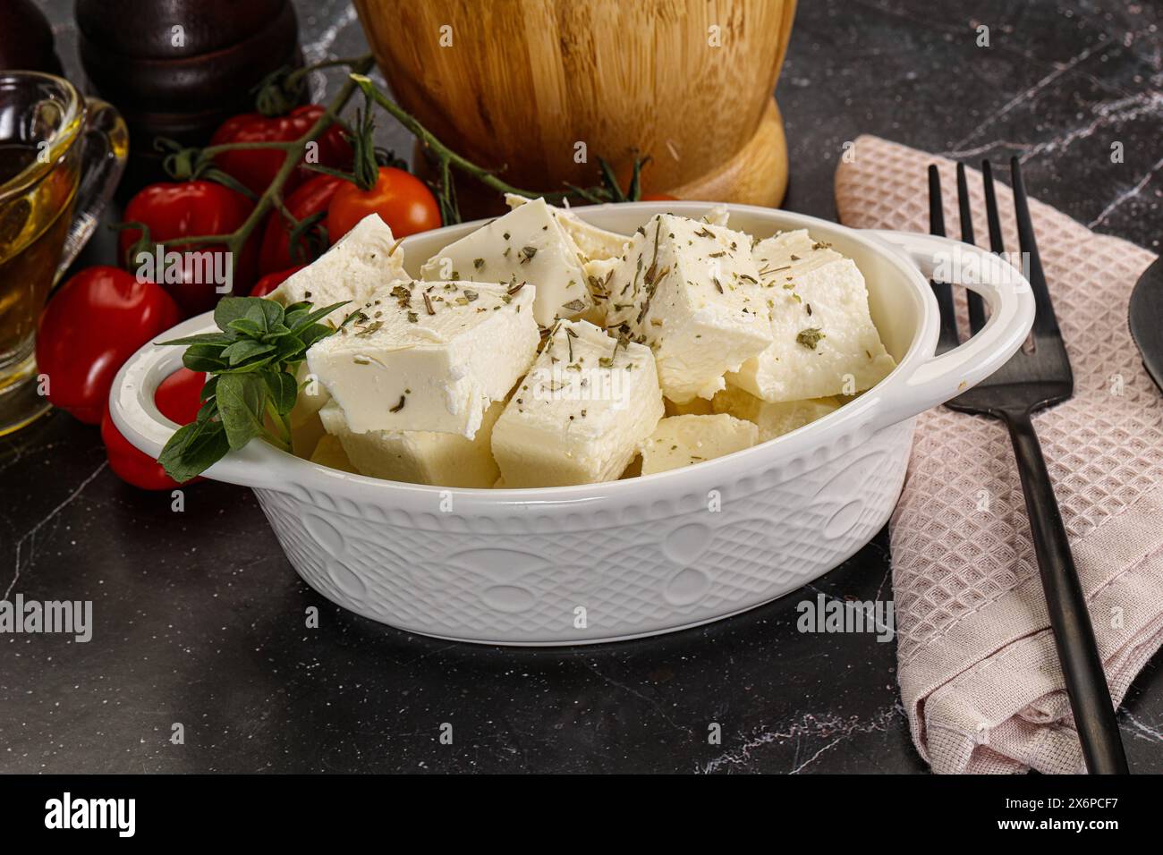 Greek traditional Feta cheese cubes with herbs and spices Stock Photo ...