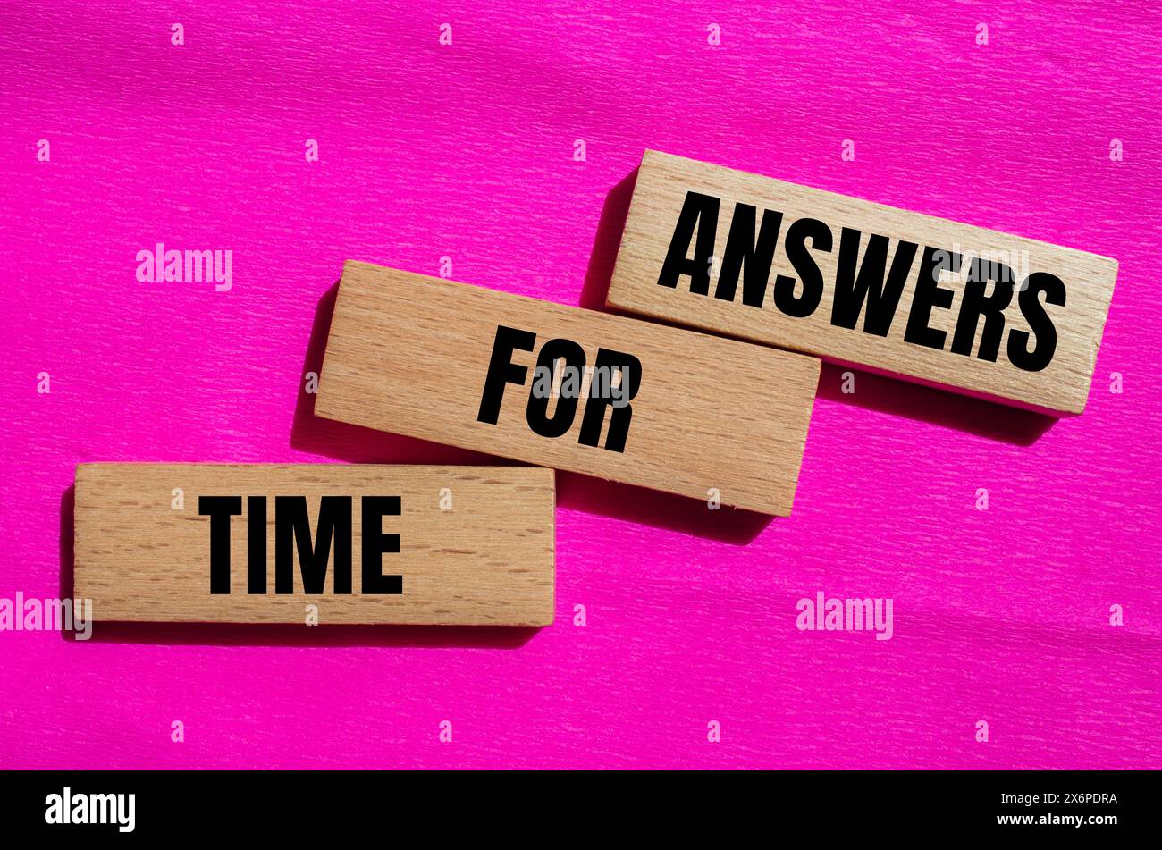 Time for answers words written on wooden blocks with pink background ...