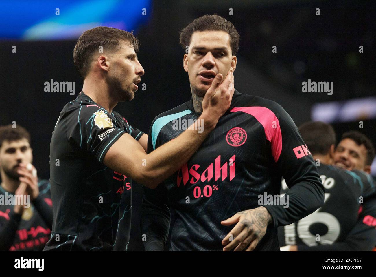 Ederson, the Manchester City goalkeeper (r) is consoled after the game ...