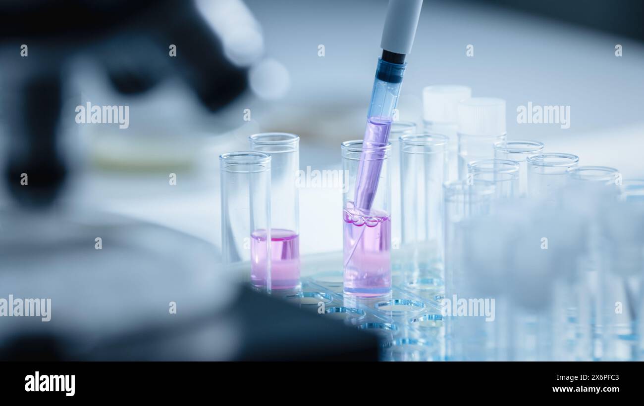 Close Up Shot of a Scientist Using Micro Pipette and Mixing Chemical ...