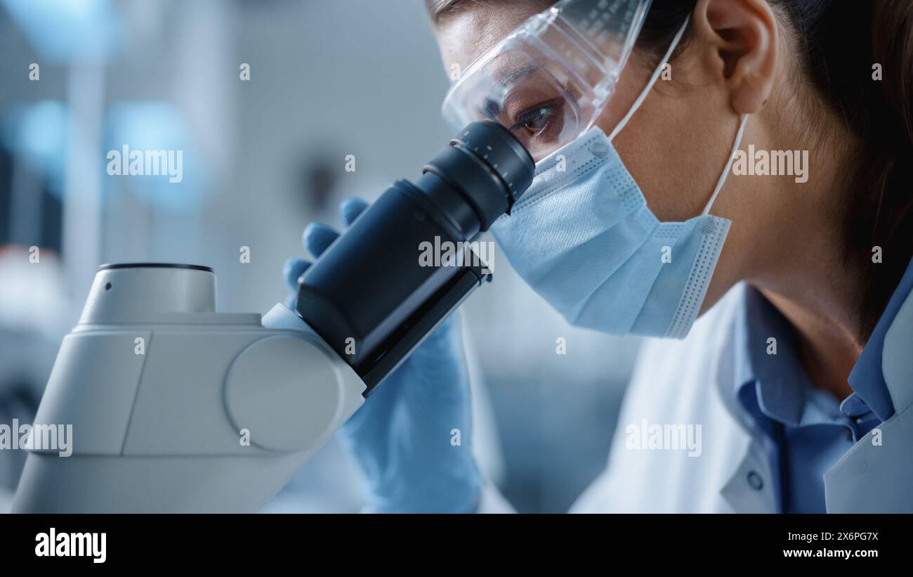 Macro Close Up Shot of a Female Scientist in Face Mask and Goggles ...