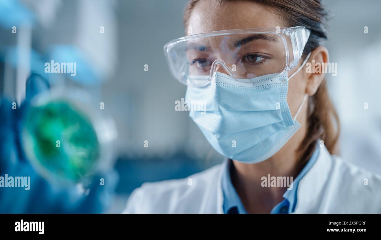 Beautiful Female Scientist Wearing Face Mask and Glasses Looking a ...