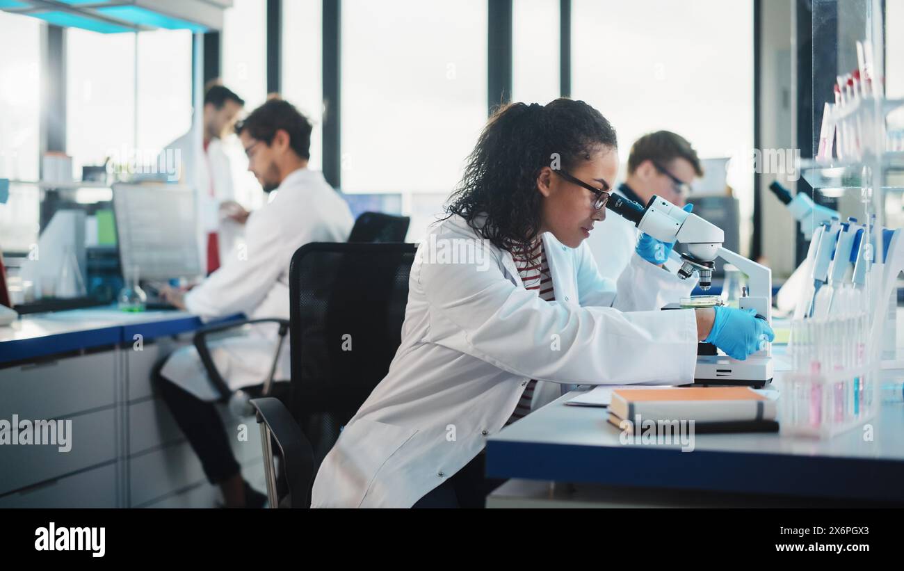 Medical Science Laboratory: Beautiful Black Scientist Looking Under ...