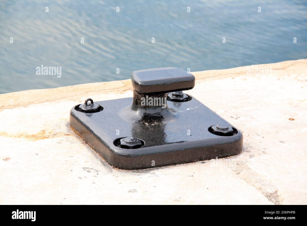 Bolard for boat mooring in port Stock Photo - Alamy