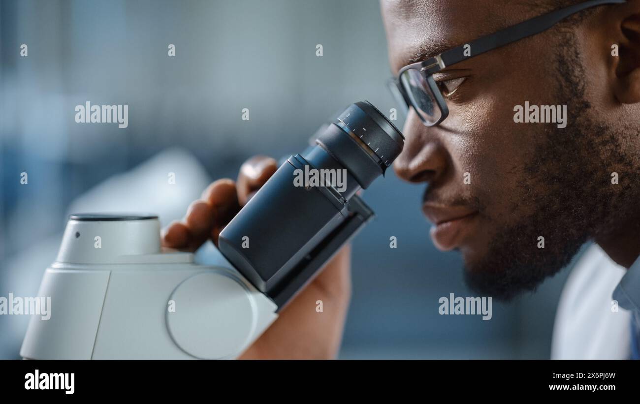 Macro Close Up Shot of a Handsome Black Male Scientist Wearing Glasses ...