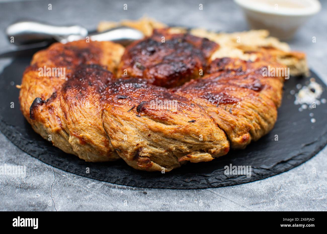 Roasted seitan as plant based meat on slate stone Stock Photo - Alamy