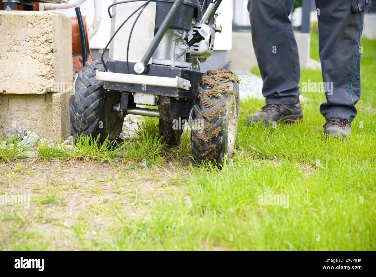 Gardener Lays Boundary Wire For Lawn Robot With Cable Laying Machine ...