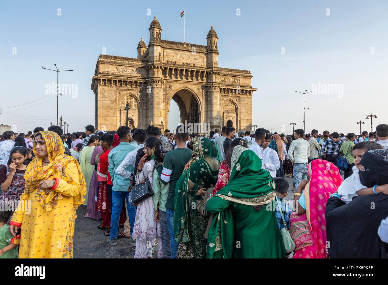 Local women in colourful dress below the Gateway of India, Mumbai ...