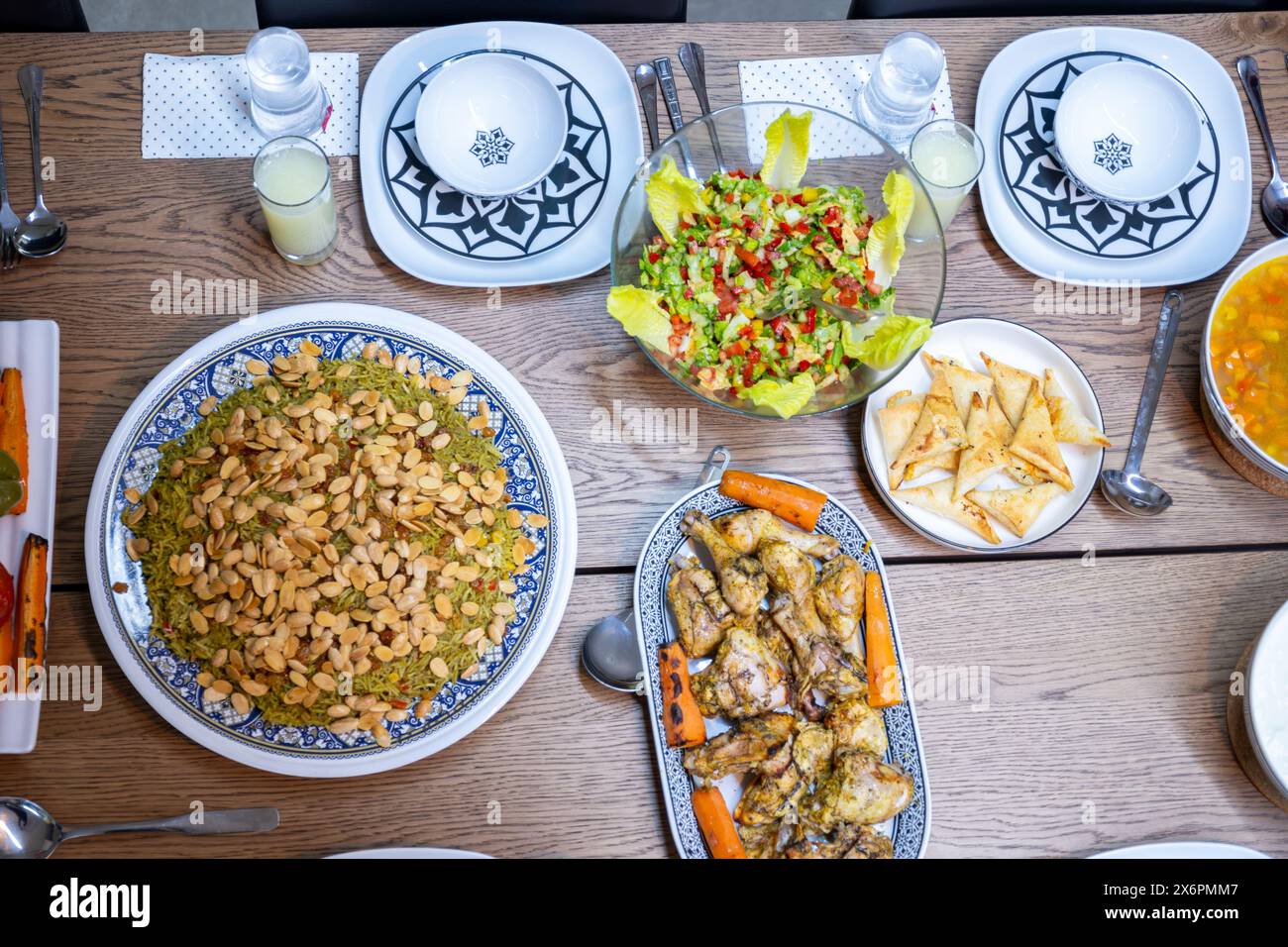Rice plate on dinner table from top view for kabsa and sambousek ...
