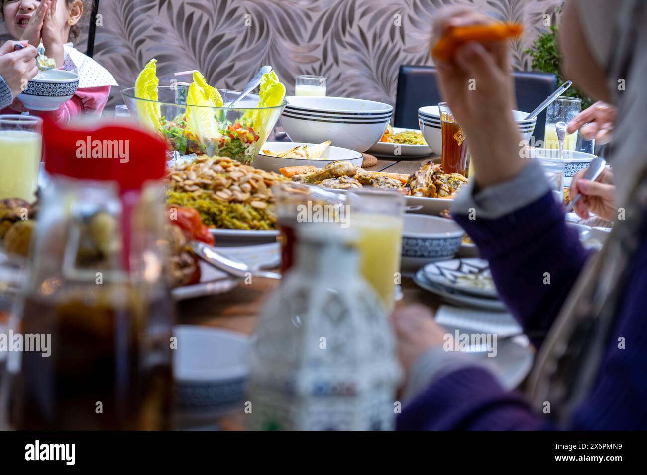 Family eating together at same dinner table Stock Photo - Alamy