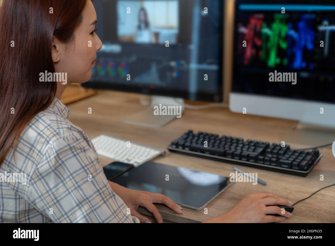 a young woman editing Video Stock Photo - Alamy