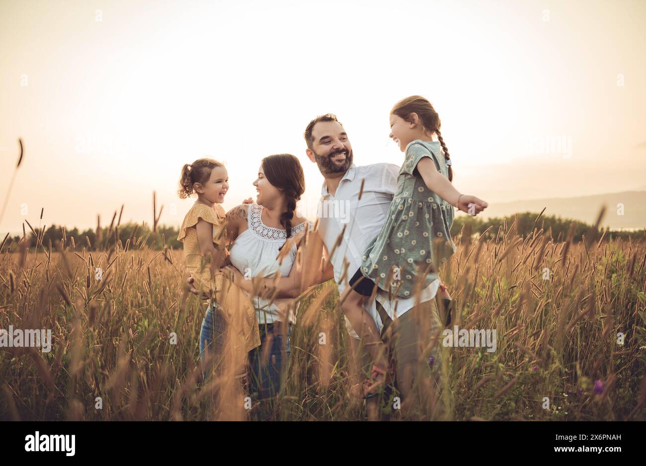 Happy family mother father and children daughter on nature sunset Stock ...