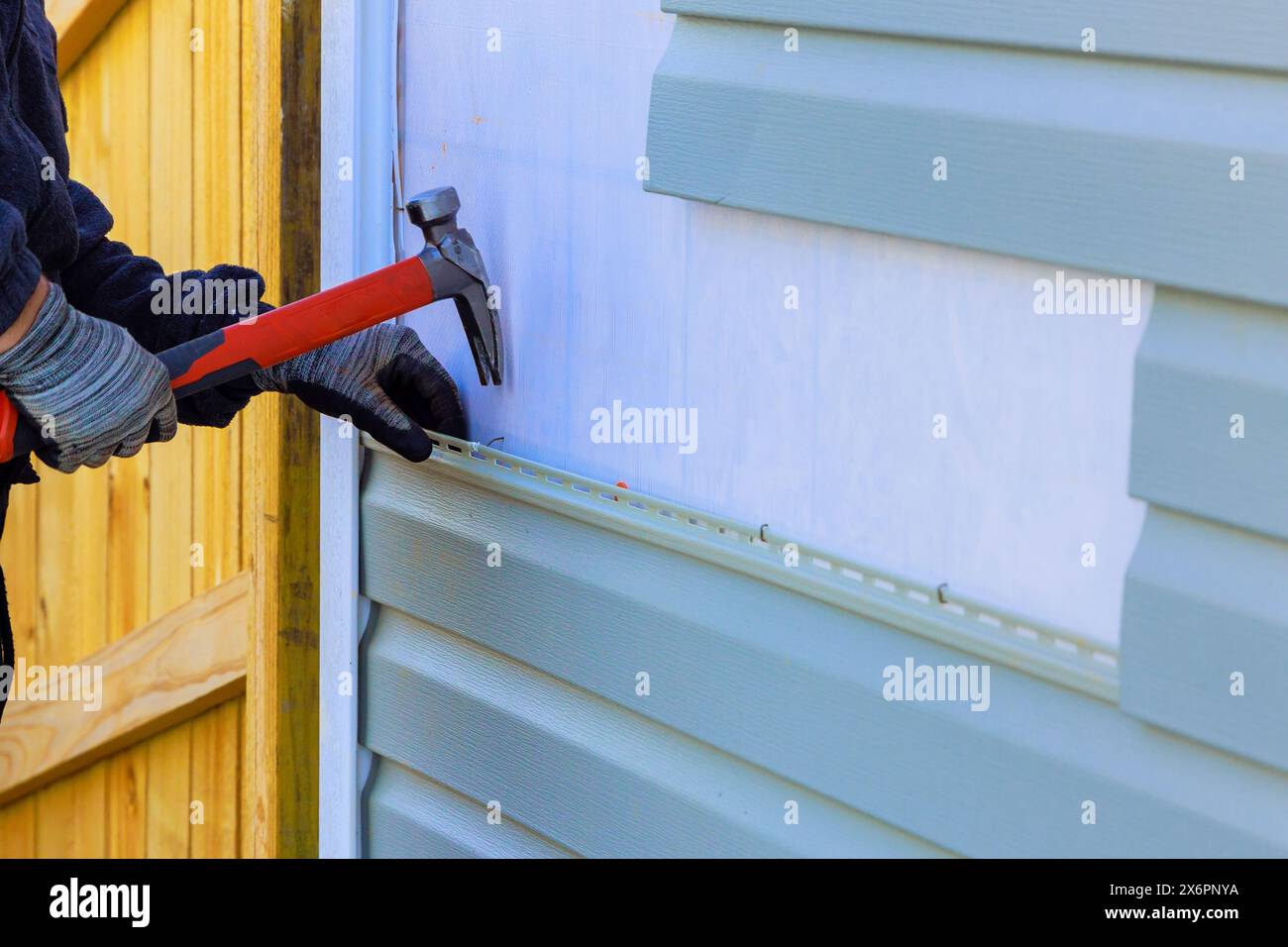 Plastic siding replacement on house exterior wall Stock Photo - Alamy