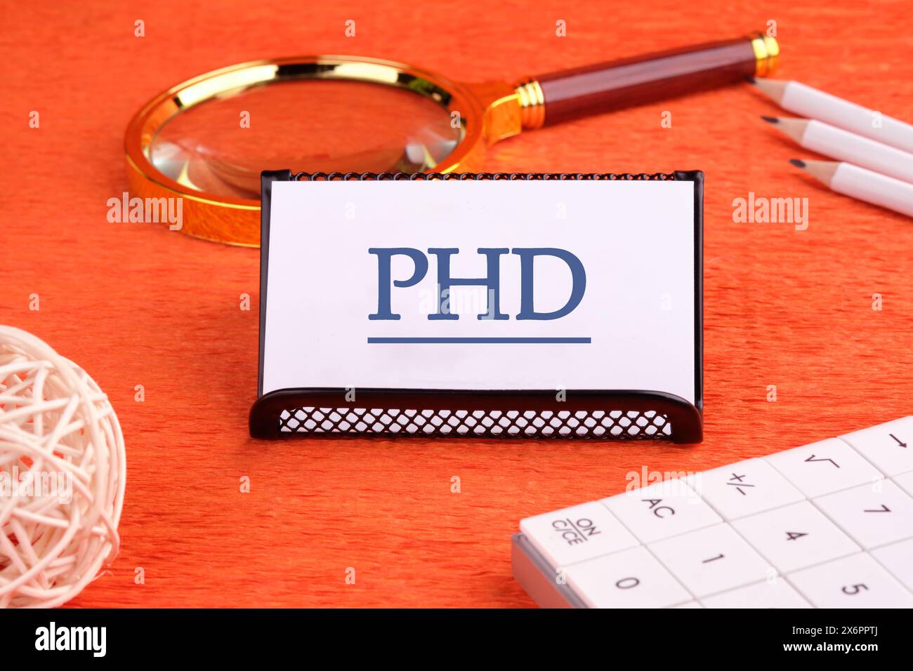Word PhD. Doctor of Philosophy. PHD on a white business card on an ...