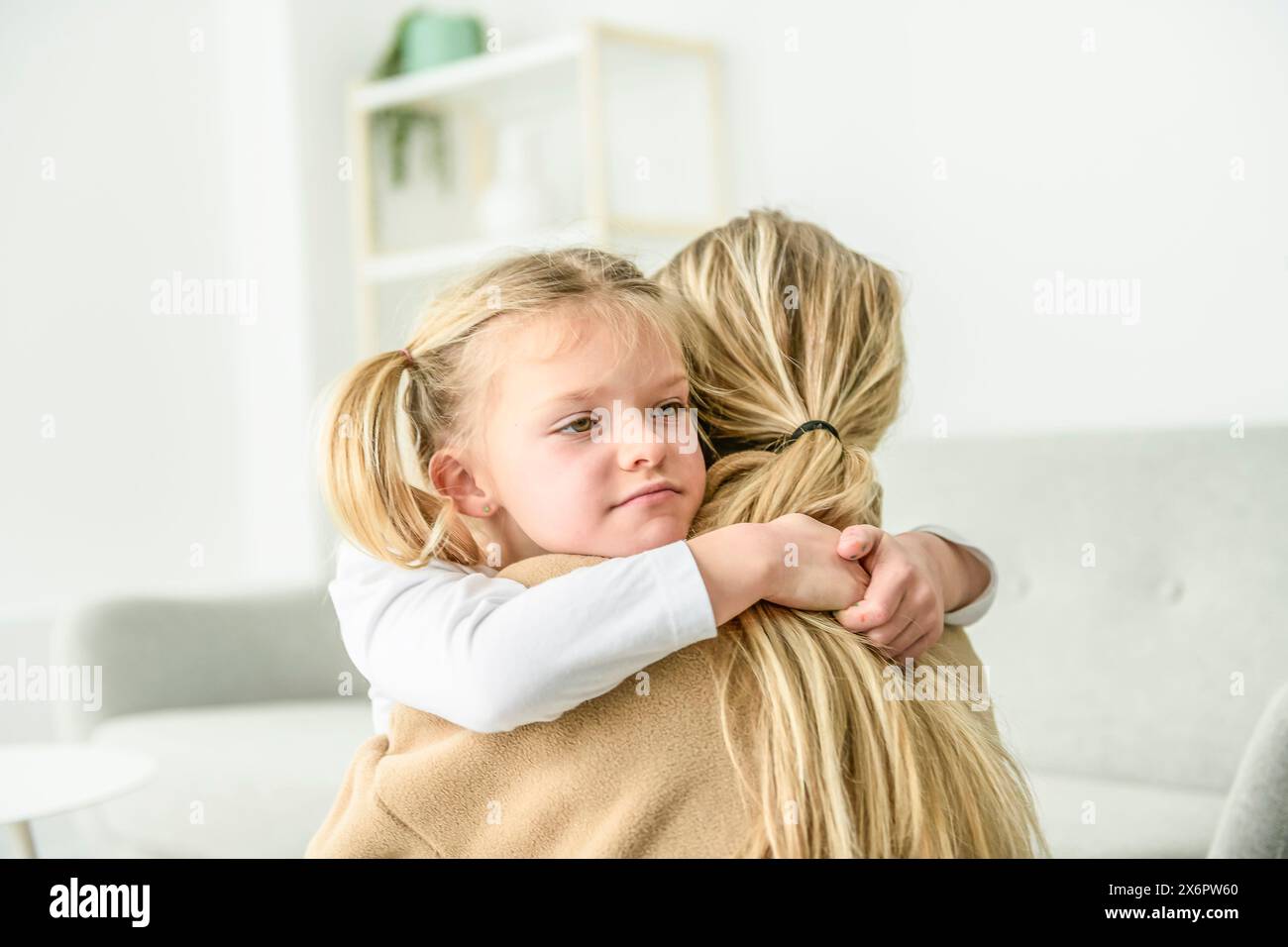 mother hugging and consoling little preschool frustrated girl Stock ...