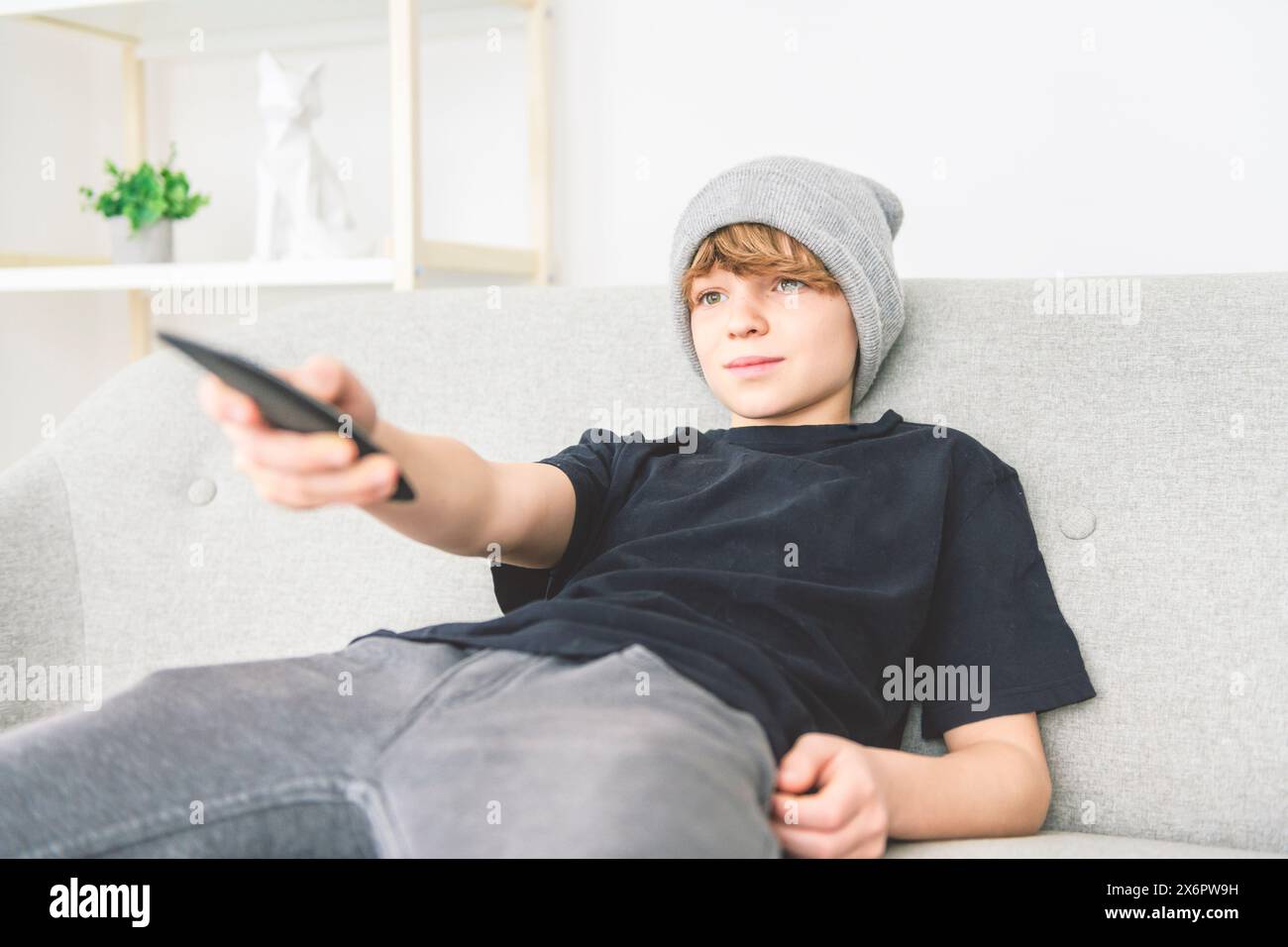 Serious boy watching tv on hi-res stock photography and images - Alamy