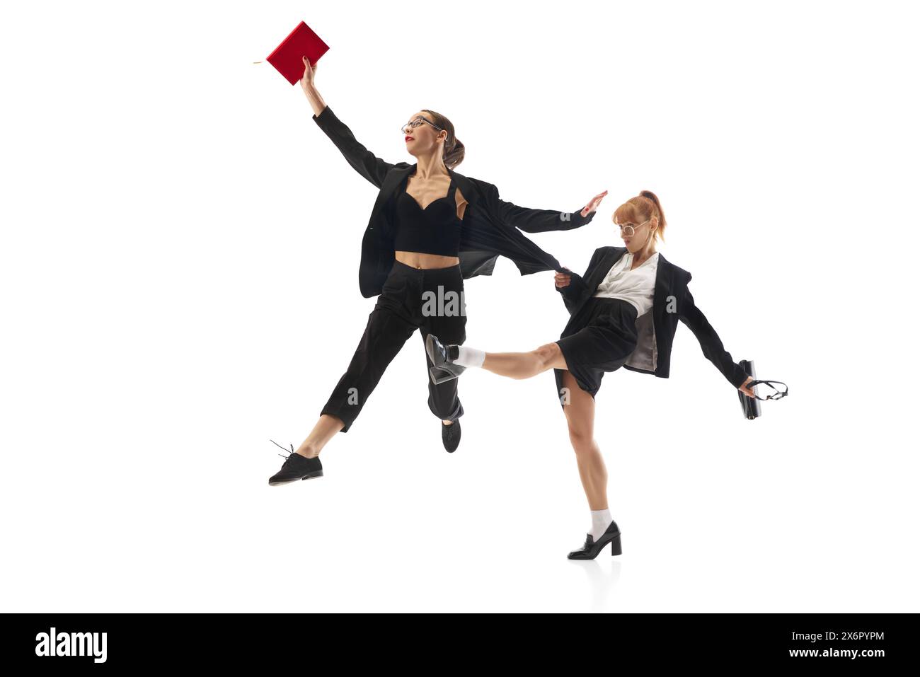 Professional competition. Two women in formal wear, employees moving ...
