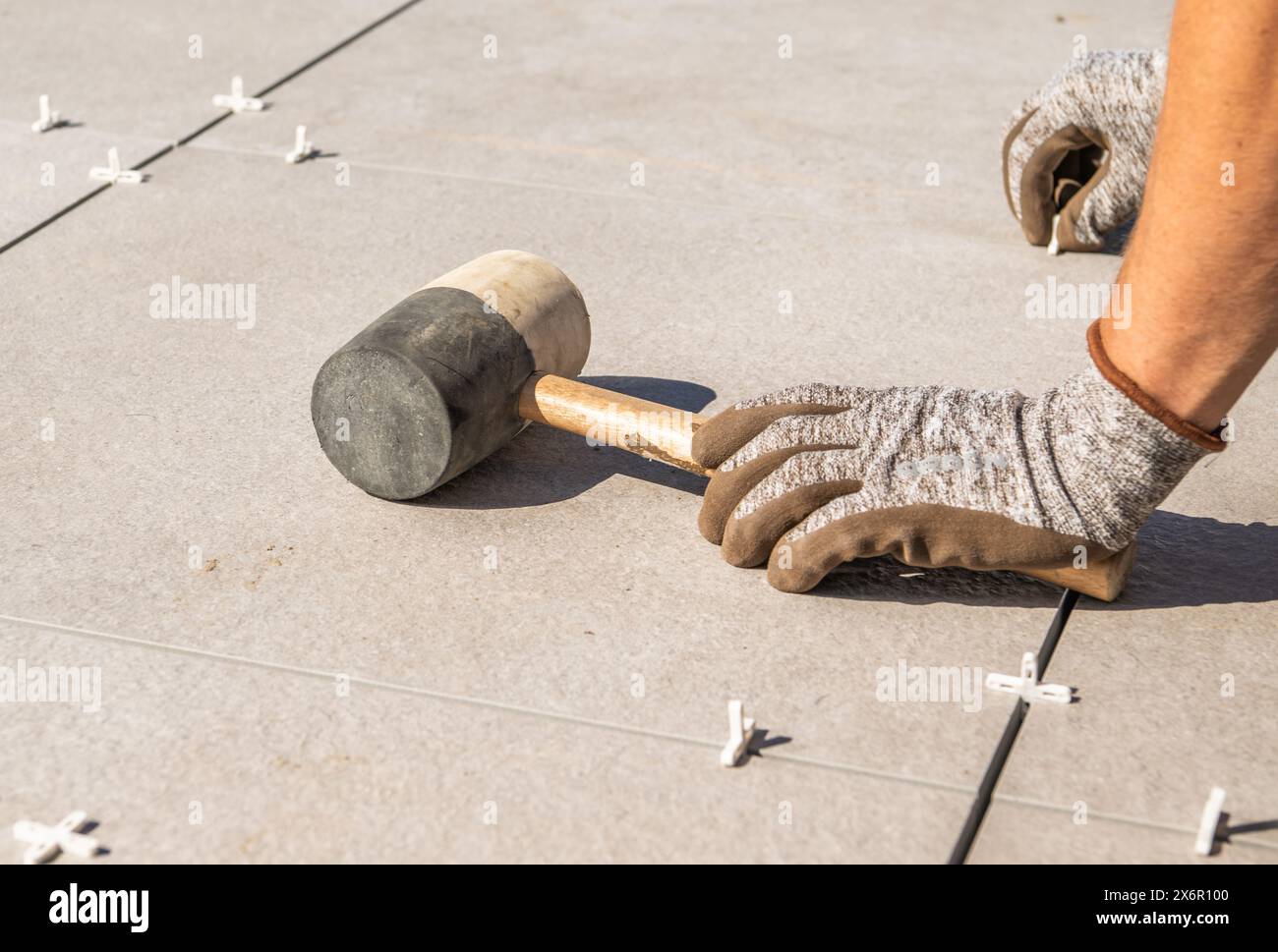 Man tiling floor hi-res stock photography and images - Alamy