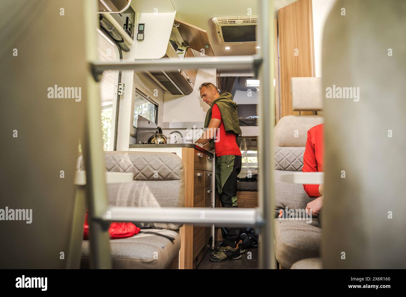 Family relaxing inside a recreational vehicle. RV Theme Stock Photo - Alamy