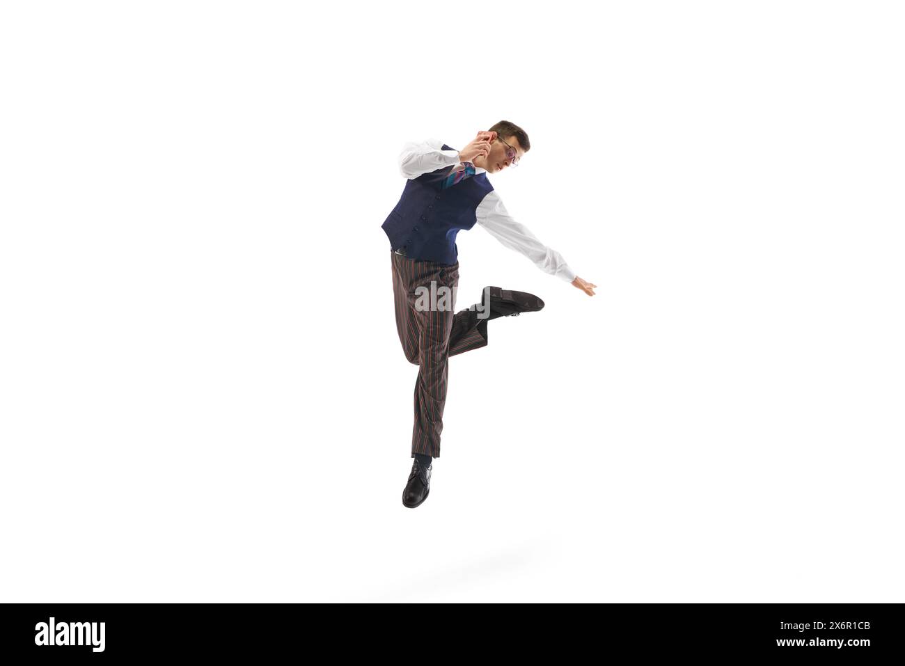 Man, employee in formal wear, jumping and talking on mobile phone ...