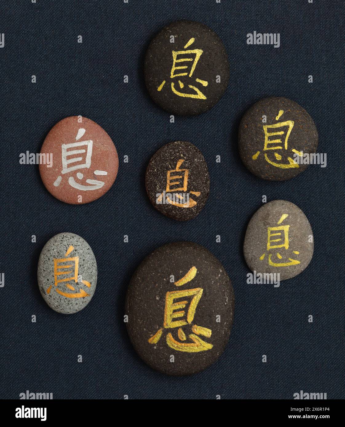 Chinese character xi or Japanese iki, meaning rest, written on pebble ...