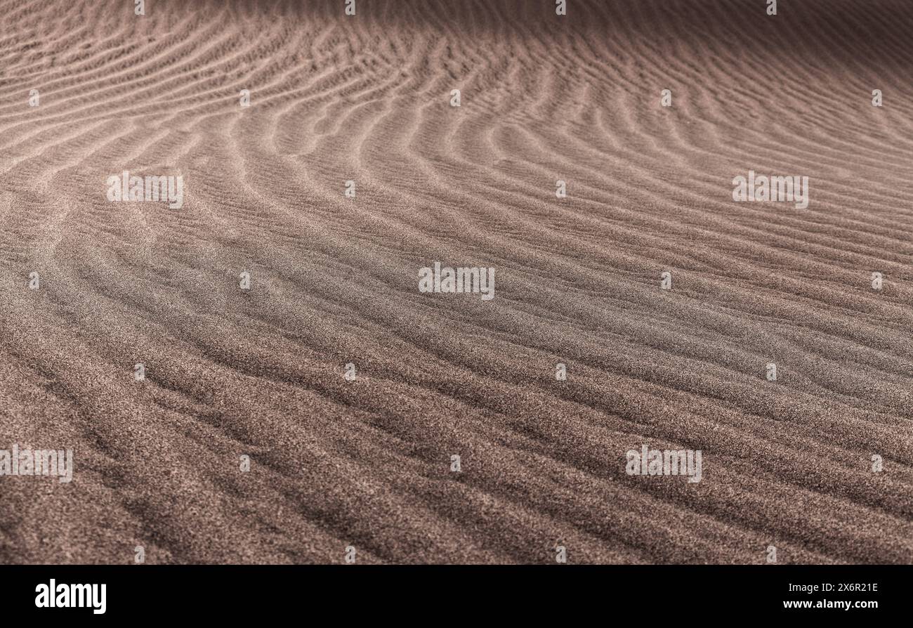 natural sand pattern created by wind blowing differently sized and ...