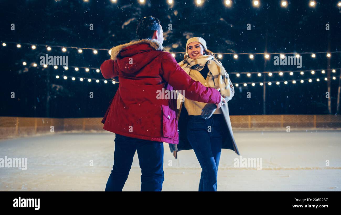 Romantic Winter Snowy Evening: Ice Skating Couple Having Fun, Step on ...