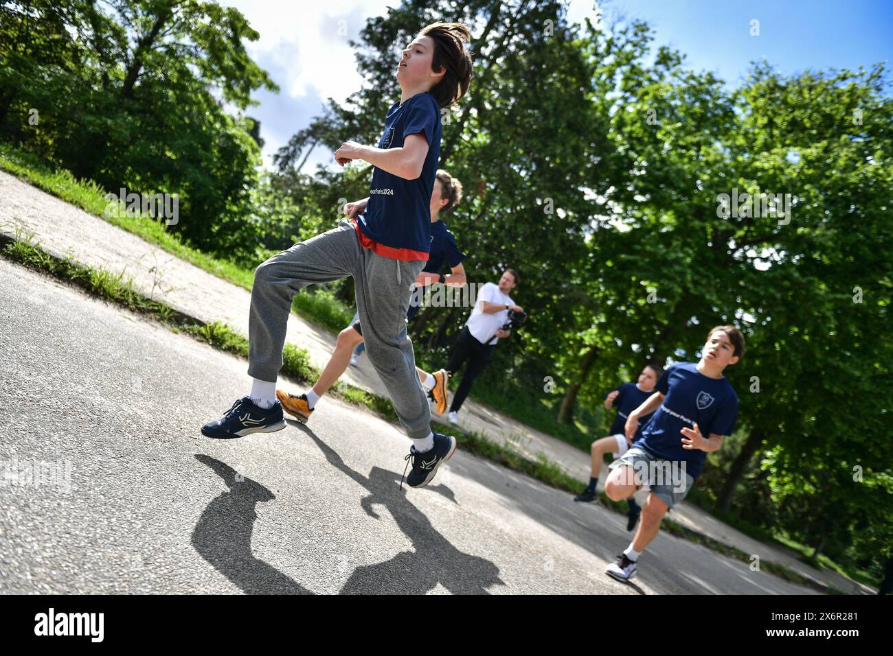 Children participate in a running race of 2,024 m on the track at the ...
