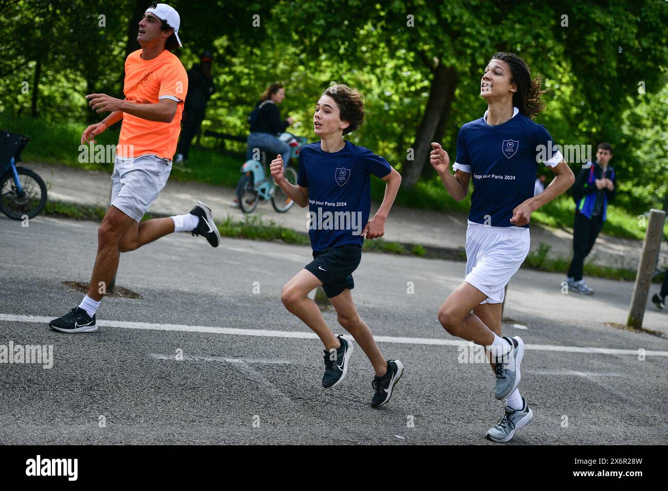 Children participate in a running race of 2,024 m on the track at the ...