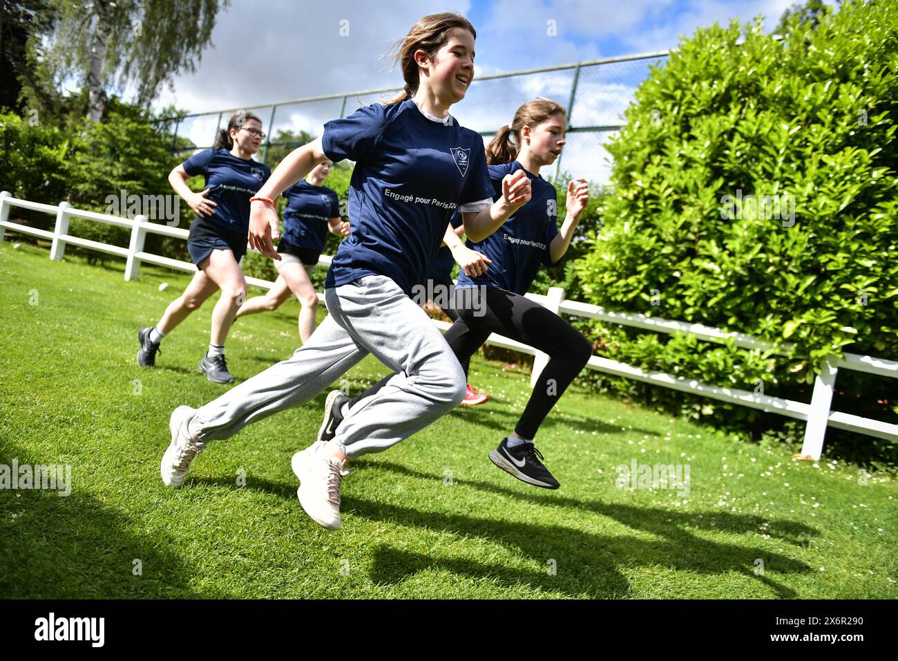 Children participate in a running race of 2,024 m on the track at the ...