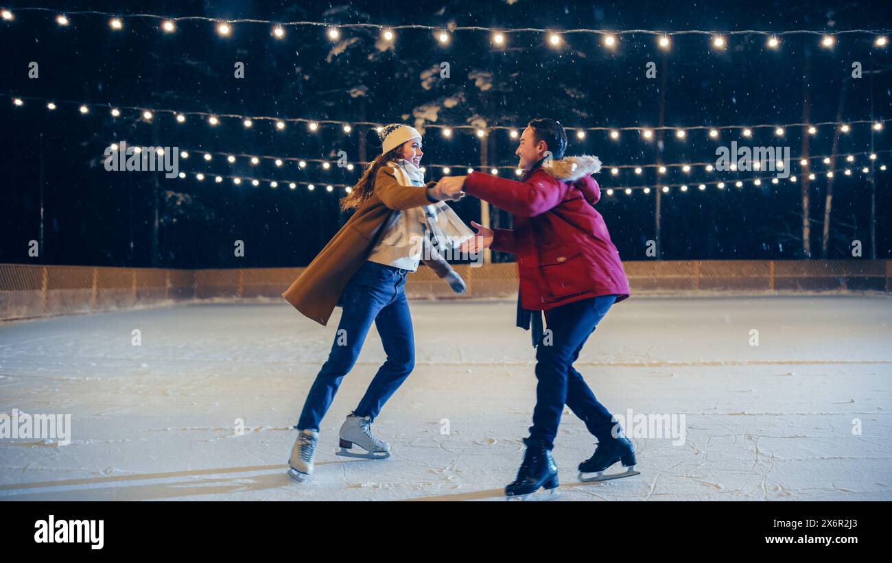 Romantic Winter Snowy Evening: Ice Skating Couple Having Fun, Step on ...