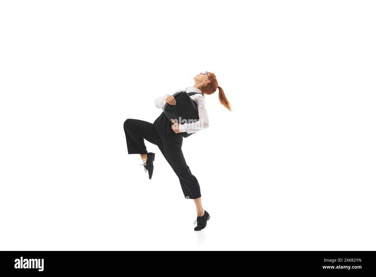 Focused woman in formal wear, manager in motion wit brief case, running ...