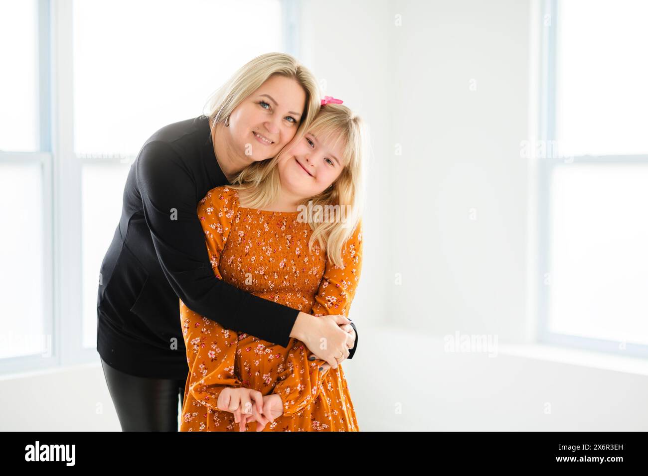 Teen with down syndrome with family hi-res stock photography and images ...