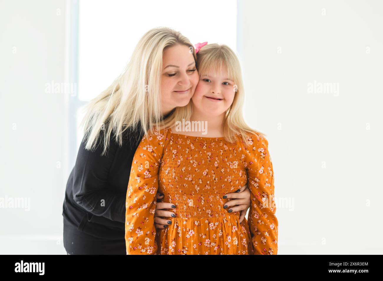 Teen with down syndrome with family hi-res stock photography and images ...